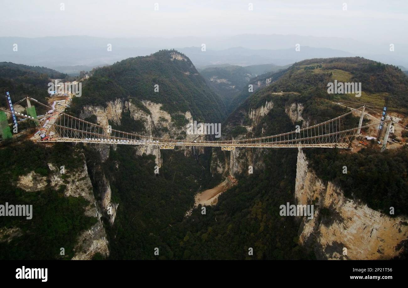 A partially-completed 430-meter (1,410-foot) bridge stretches about 300 ...