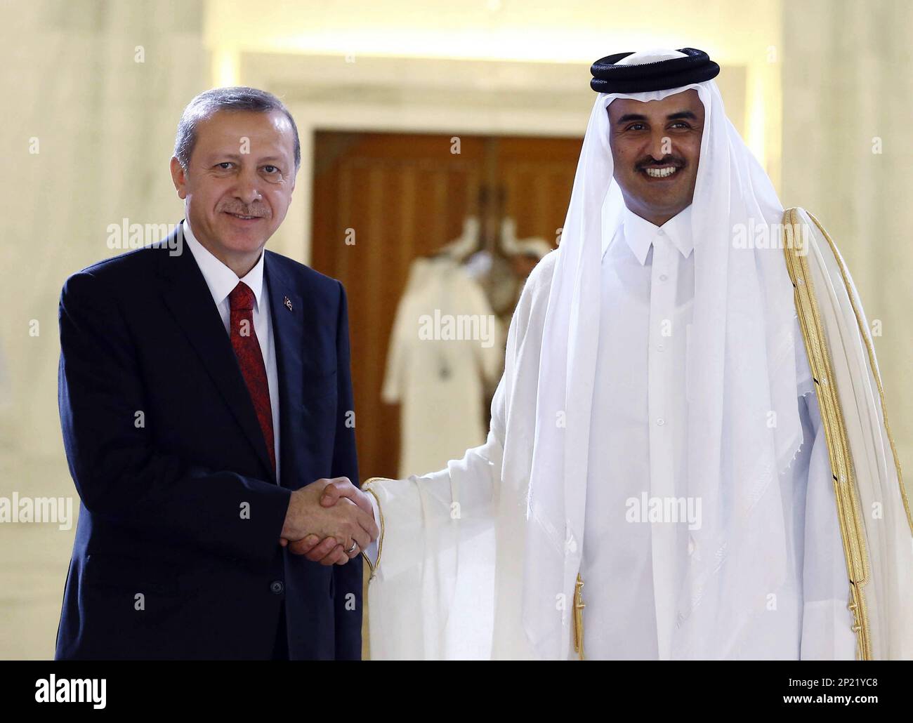 Turkey's President Recep Tayyip Erdogan, left, and Qatar's Emir Tamim ...