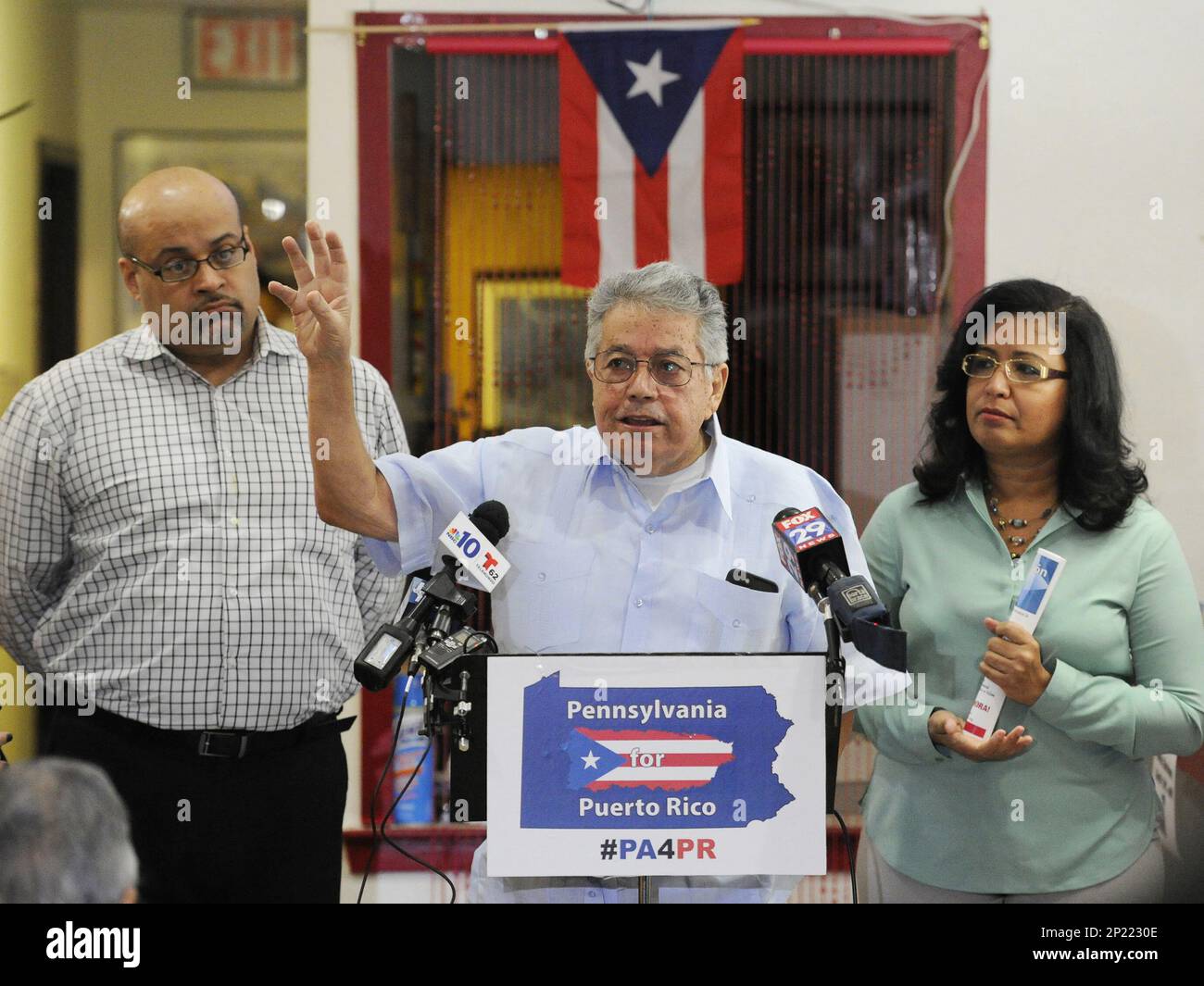 Former Philadelphia city councilor Angel Ortiz, center, addresses a ...
