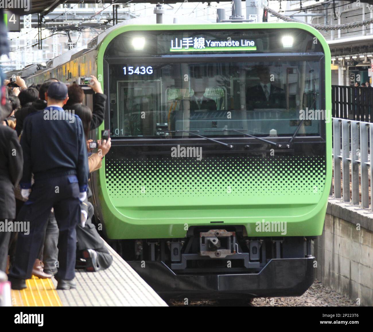 A new Yamanote Line train car arrives at the JR Osaki Station in Tokyo ...