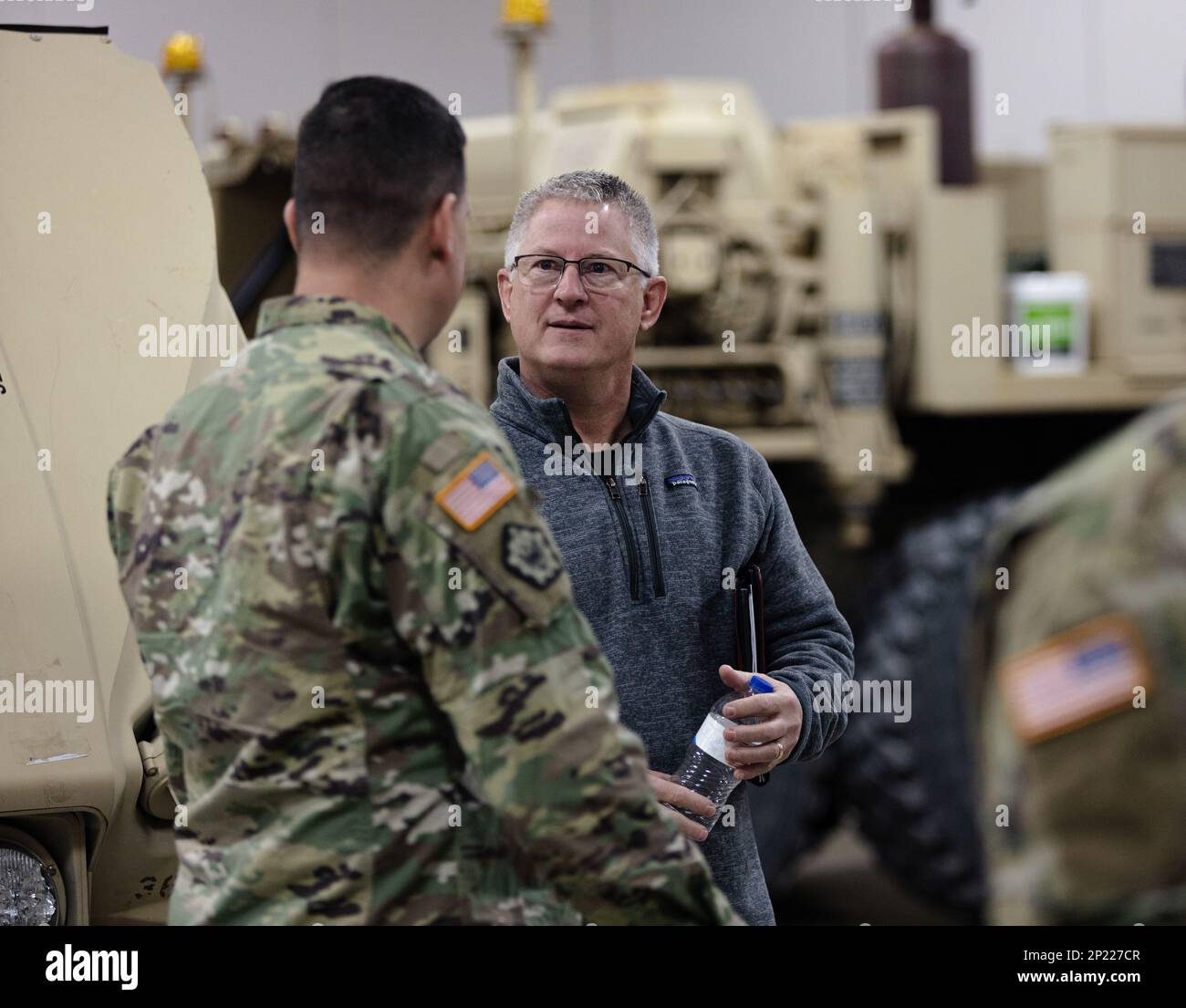 An Iowa National Guard Soldier speaks to a Knoxville community member ...