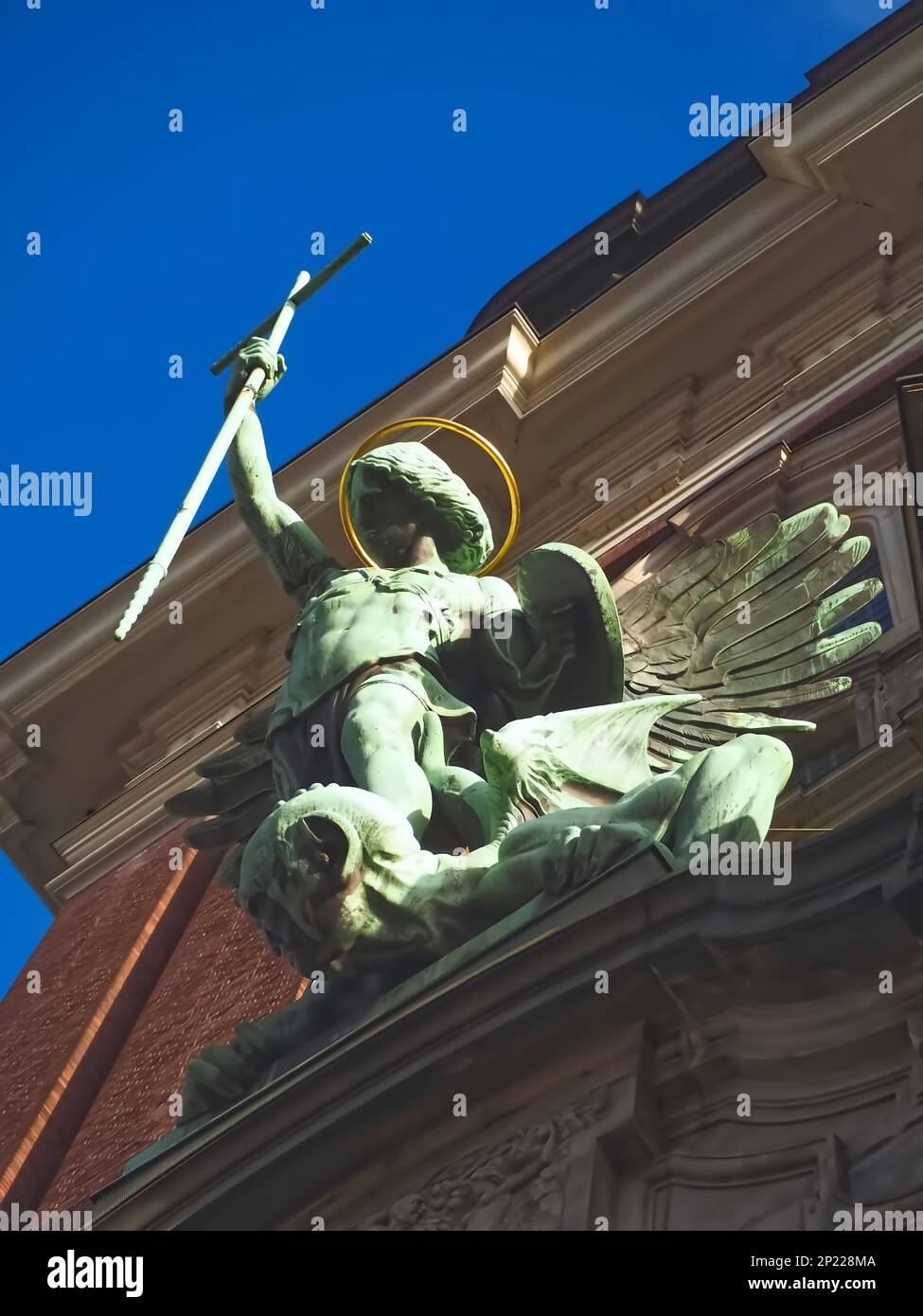 Sculpture of Archangel Michael fighting Satan at St. Michaels Church in Hamburg in Germany Stock ...