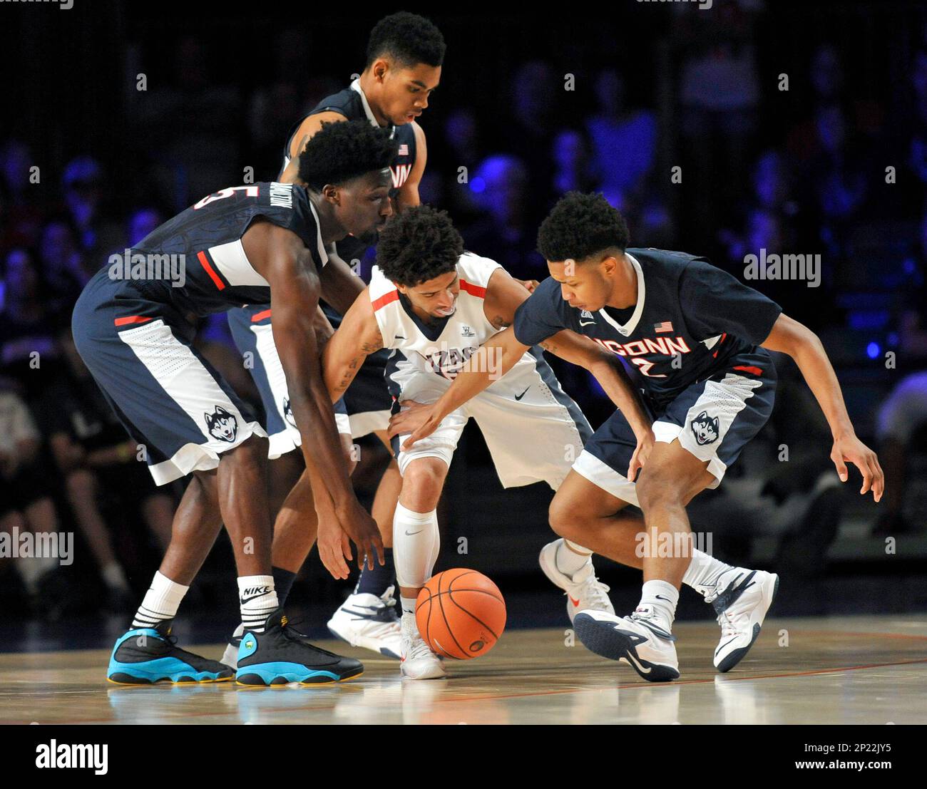 A loose ball falls in front of Connecticut forward Daniel Hamilton (5 ...
