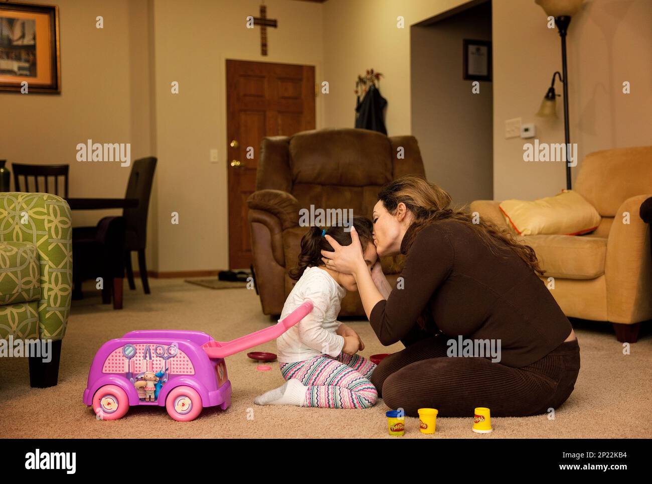 In this Nov. 19, 2015 photo, Rula Jabbour, kisses her daughter, Sama, 3 ...