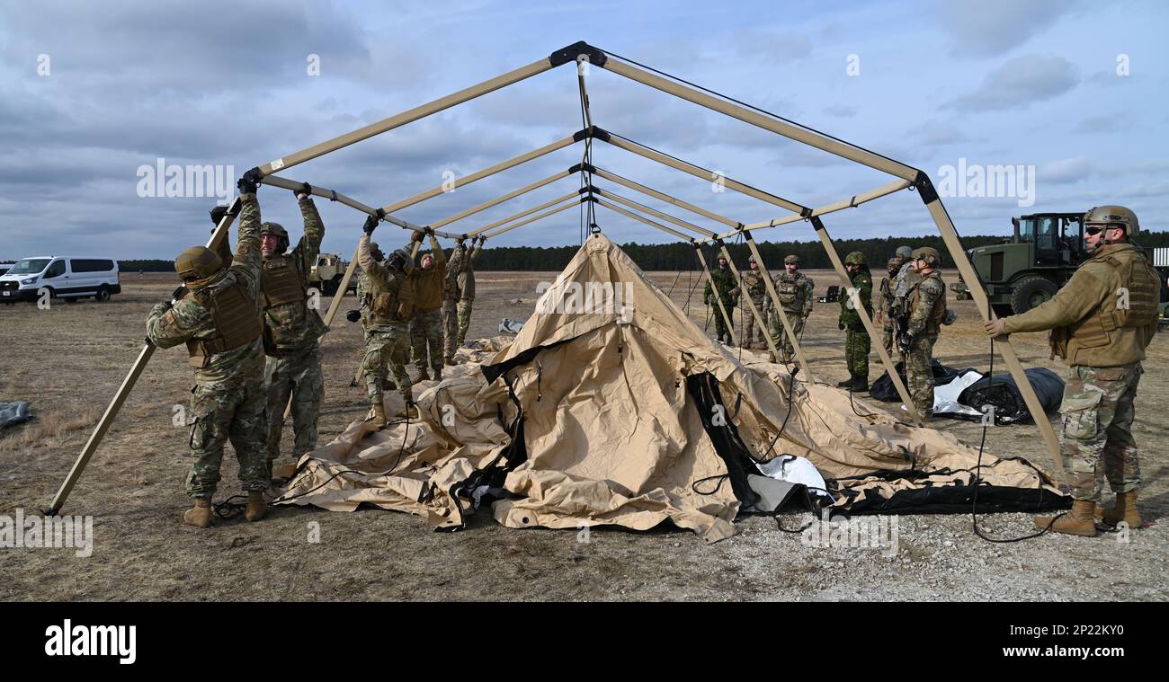 Airmen from the 621st Contingency Response Squadron set up tents with ...