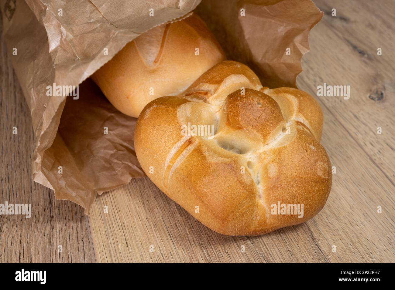 typical Milan tradition bread "michetta" wooden table Stock Photo - Alamy