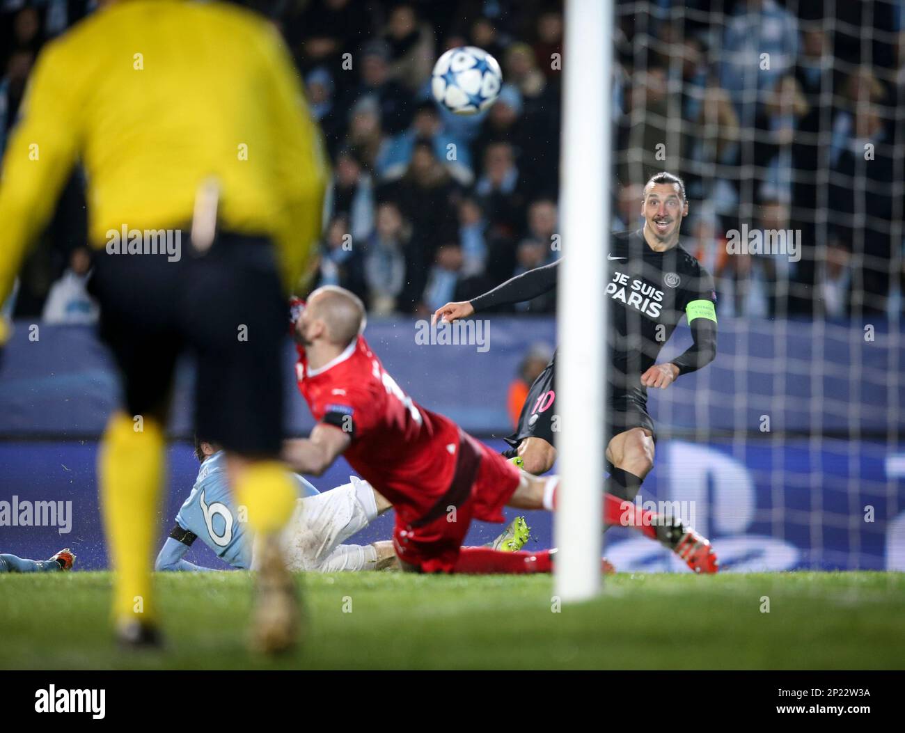 Paris SG's Zlatan Ibrahimovic, right, scores past Malmo's goalkeeper ...