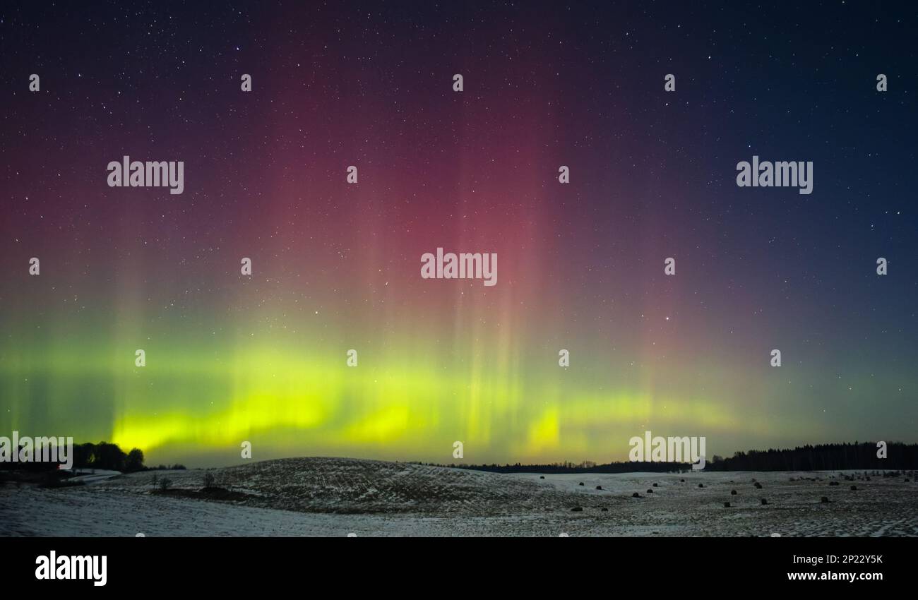 Northern lights - Aurora borealis dancing in the night sky Stock Photo ...