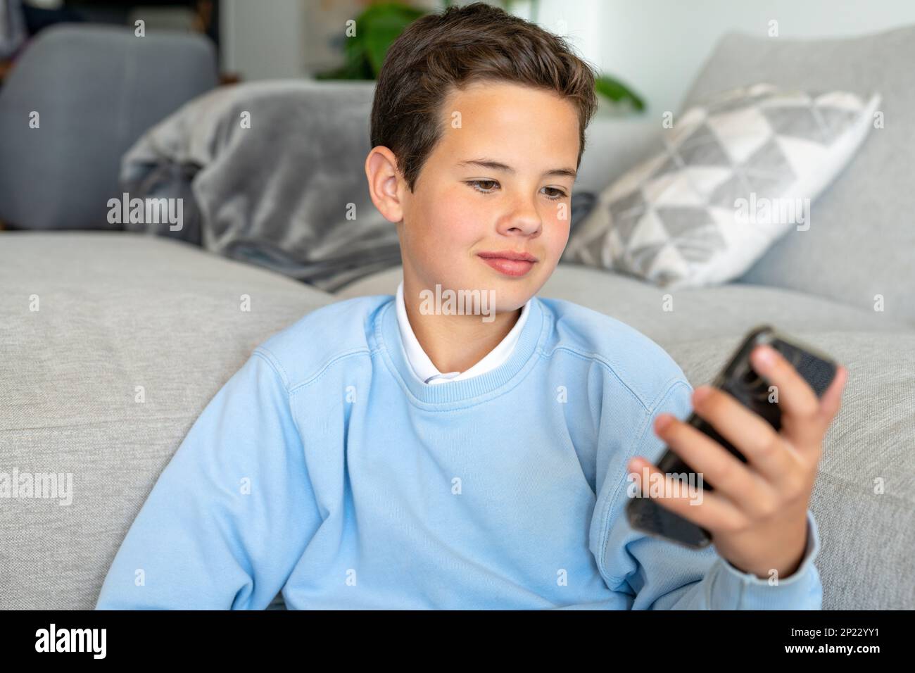 Internet and social networks for teenagers, boy concentrated on phone ...