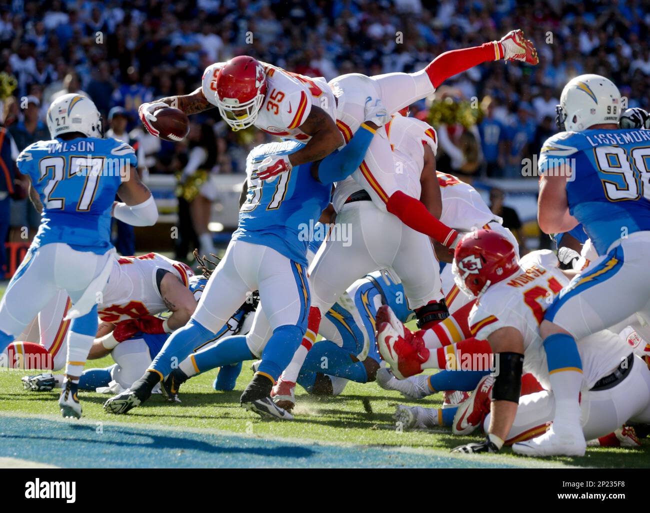Kansas City Chiefs running back Charcandrick West, top, is kept out of ...