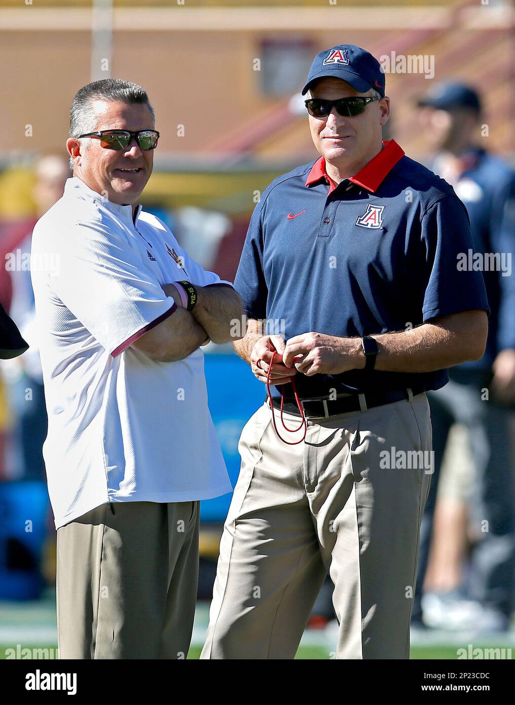 Arizona State head coach Todd Graham, left, and Arizona head coach Rich ...