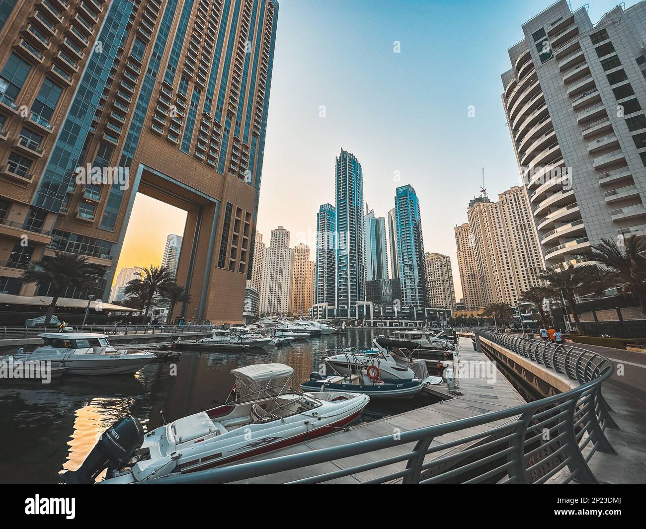 Dubai Marina, harbour, cruise boat and canal promenade view at sunset ...