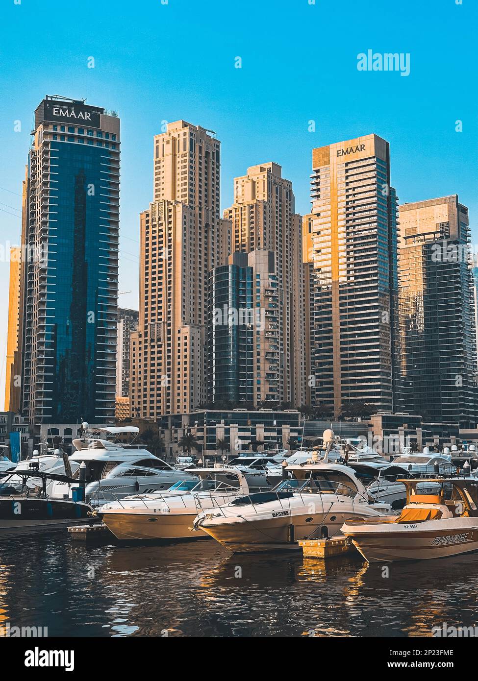 Dubai Marina, harbour, cruise boat and canal promenade view at sunset ...