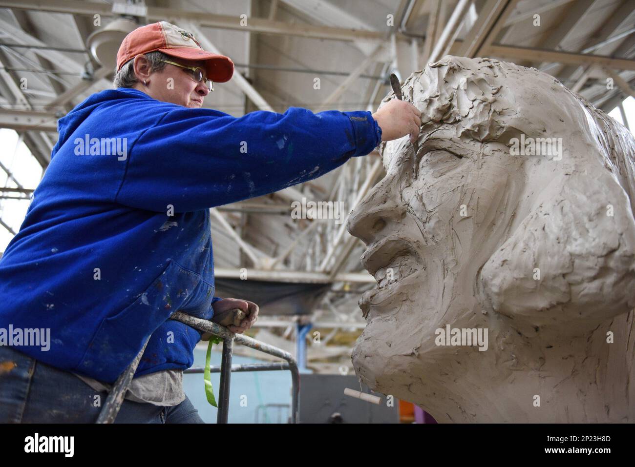 Parade Company artist Andrea Costantini works on a big head of late ...