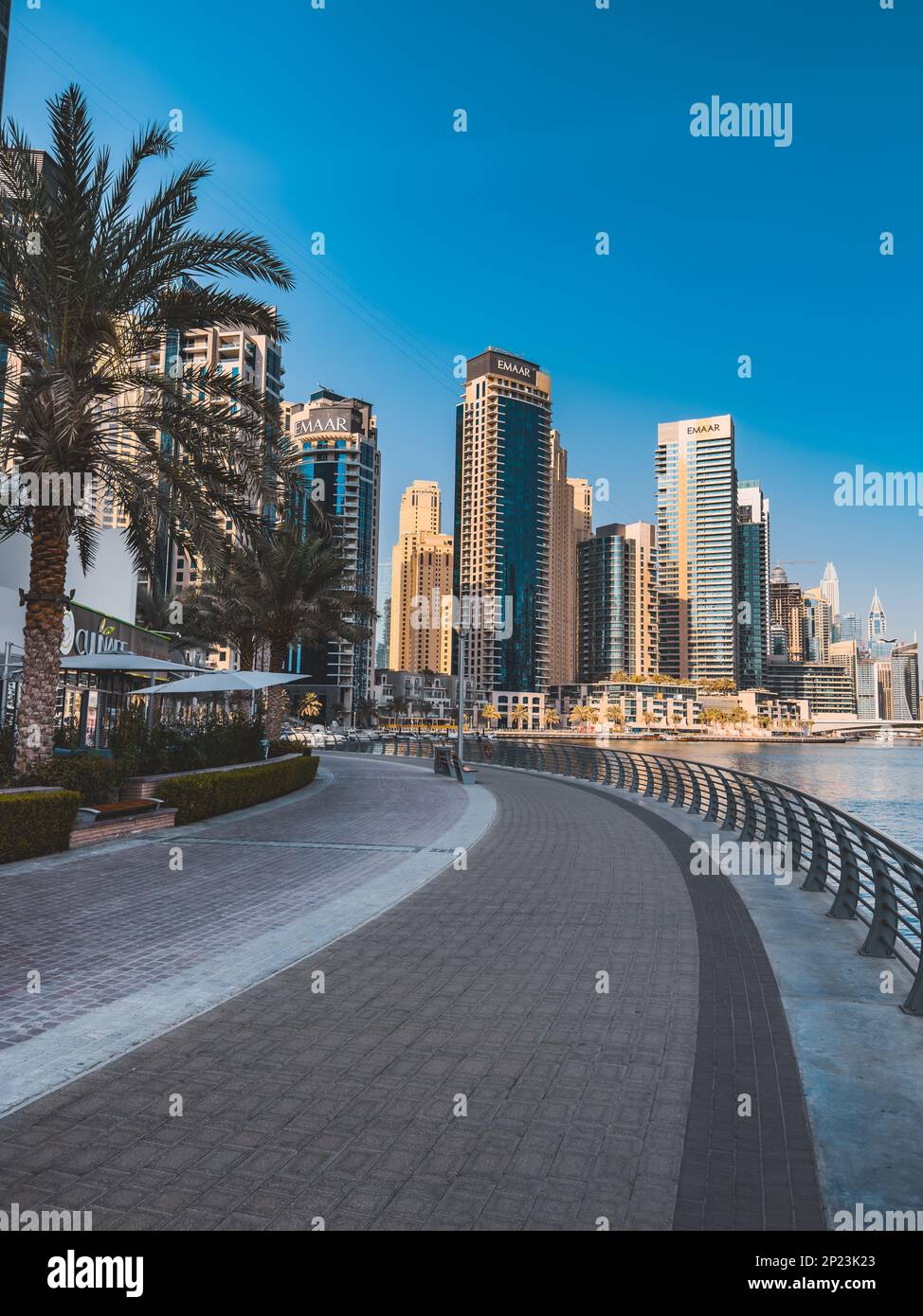 Dubai Marina, harbour, cruise boat and canal promenade view at sunset ...