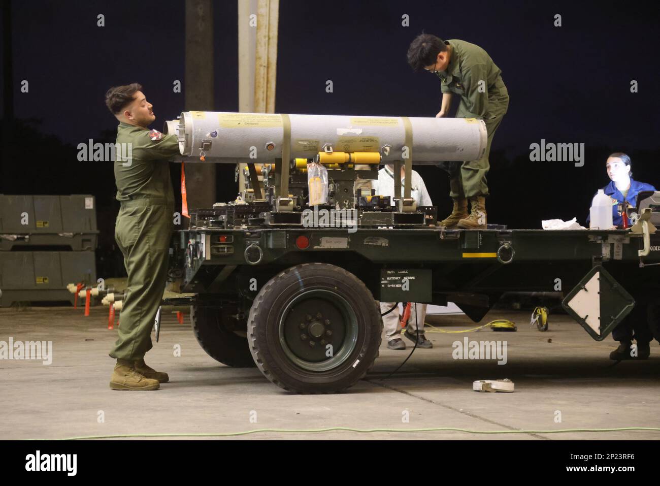U.S. Marine Corps Sgt. Jarrod Campbell and Cpl. Rita Chen, both aviation ordnance systems ...