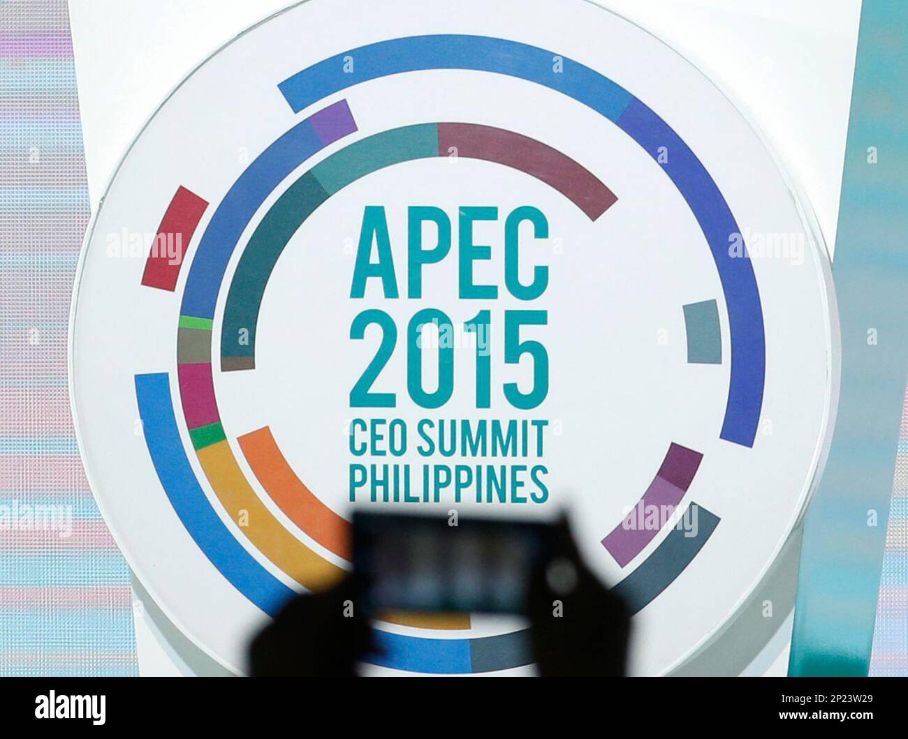 A member of the audience takes photos during the Asia-Pacific Economic ...