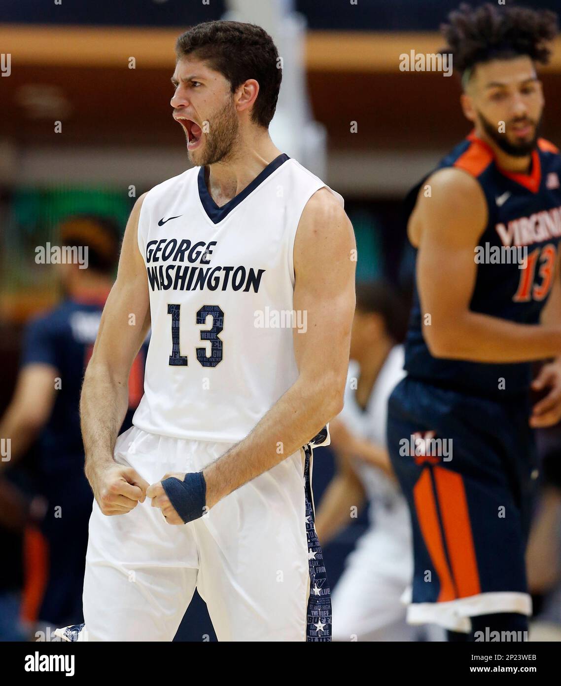 George Washington guard Patricio Garino (13) celebrates a basket with ...