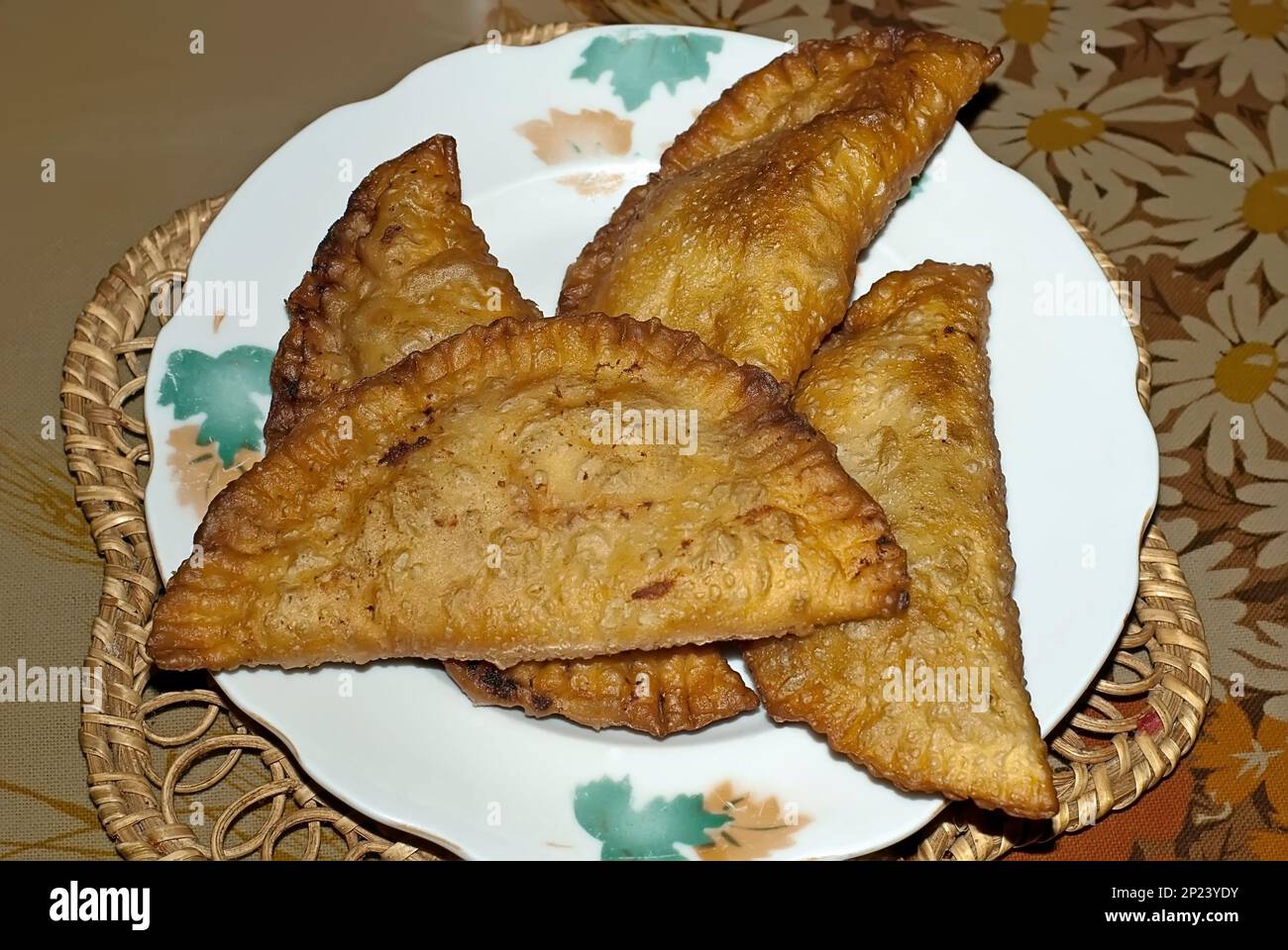 Chebureki, a deep-fried turnover with a filling of ground or minced ...
