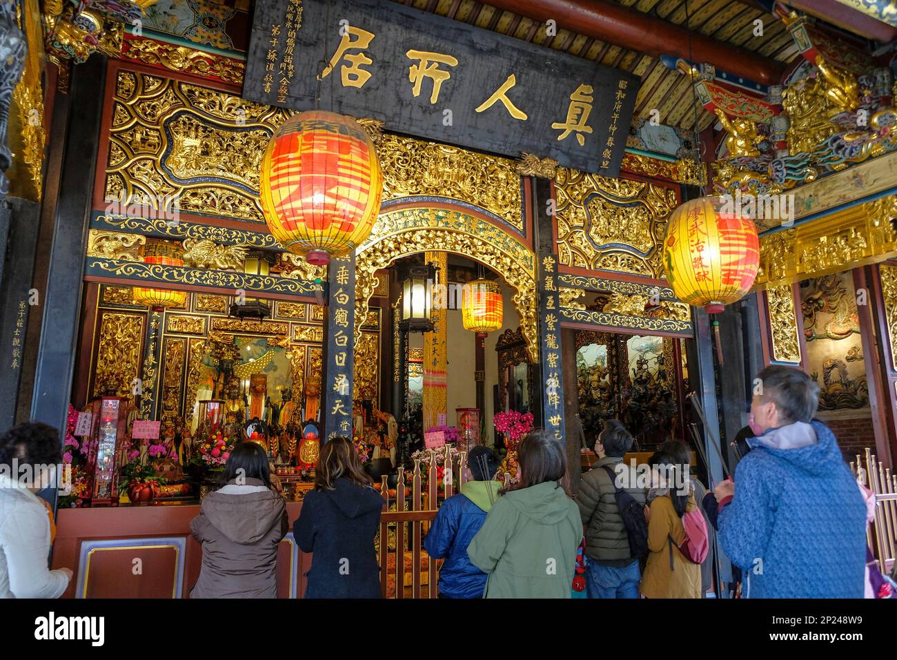 Taipei, Taiwan - January 25, 2023: People making offerings in the Baoan ...