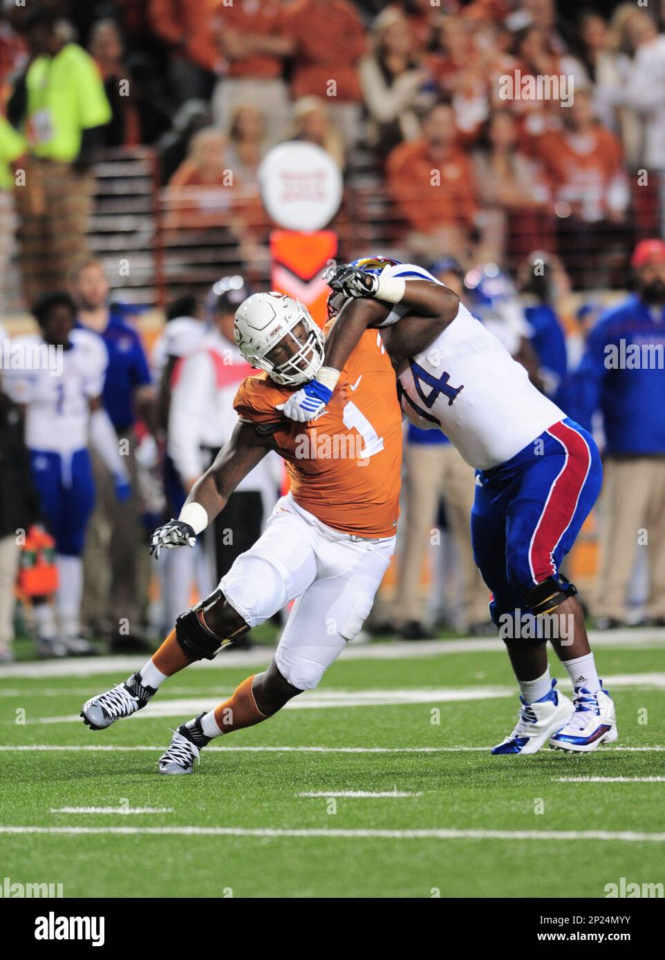07 November 2015: Texas DE Shiro Davis fights off a block from Clyde ...
