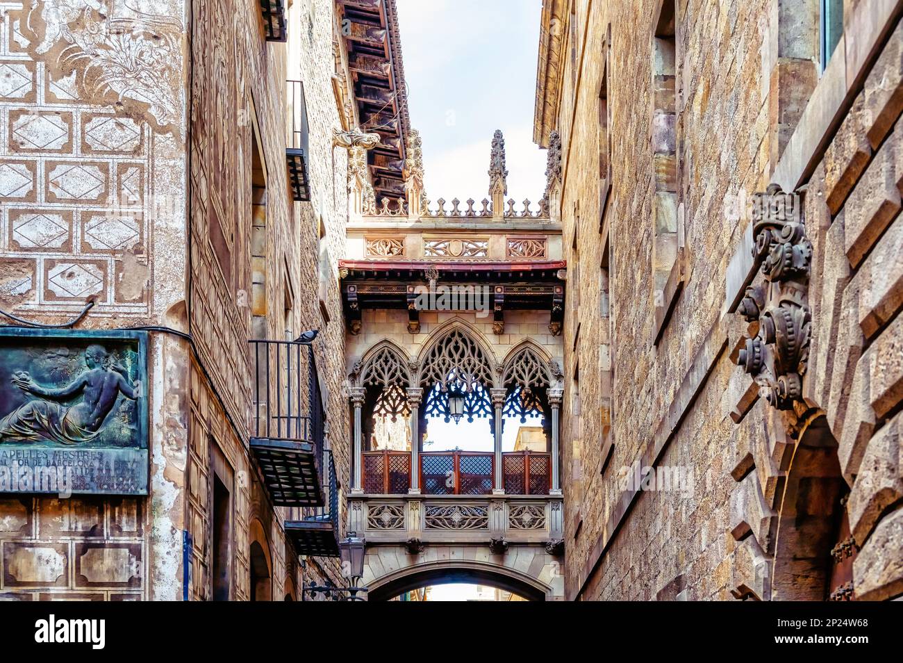 Pedestrian bridge between two medieval buildings, Barcelona, Spain ...