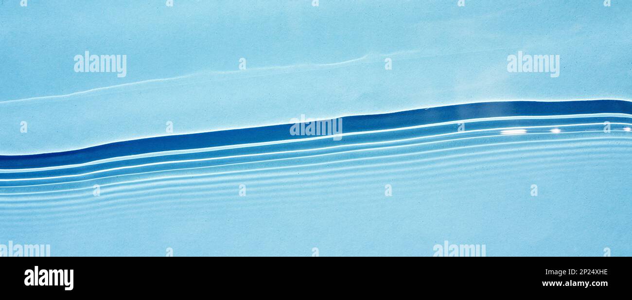 Abstract blue water background with wave and ripples Stock Photo - Alamy