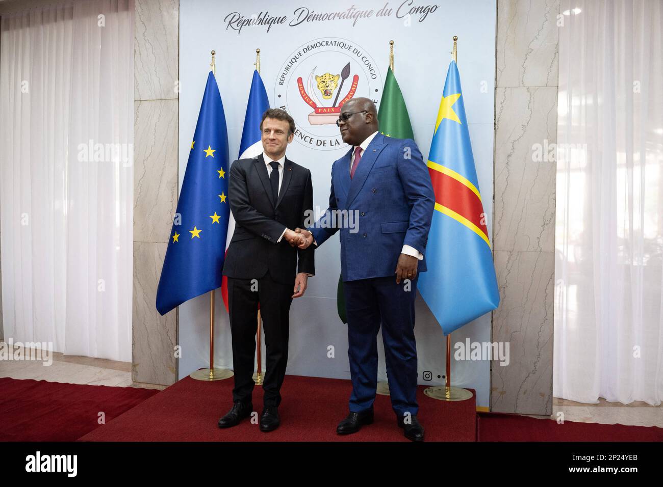 France's President Emmanuel Macron shakes hands with Democratic Republic of Congo's President ...