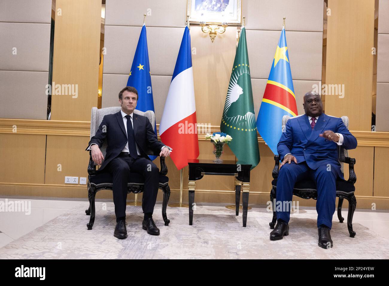 France's President Emmanuel Macron shakes hands with Democratic ...