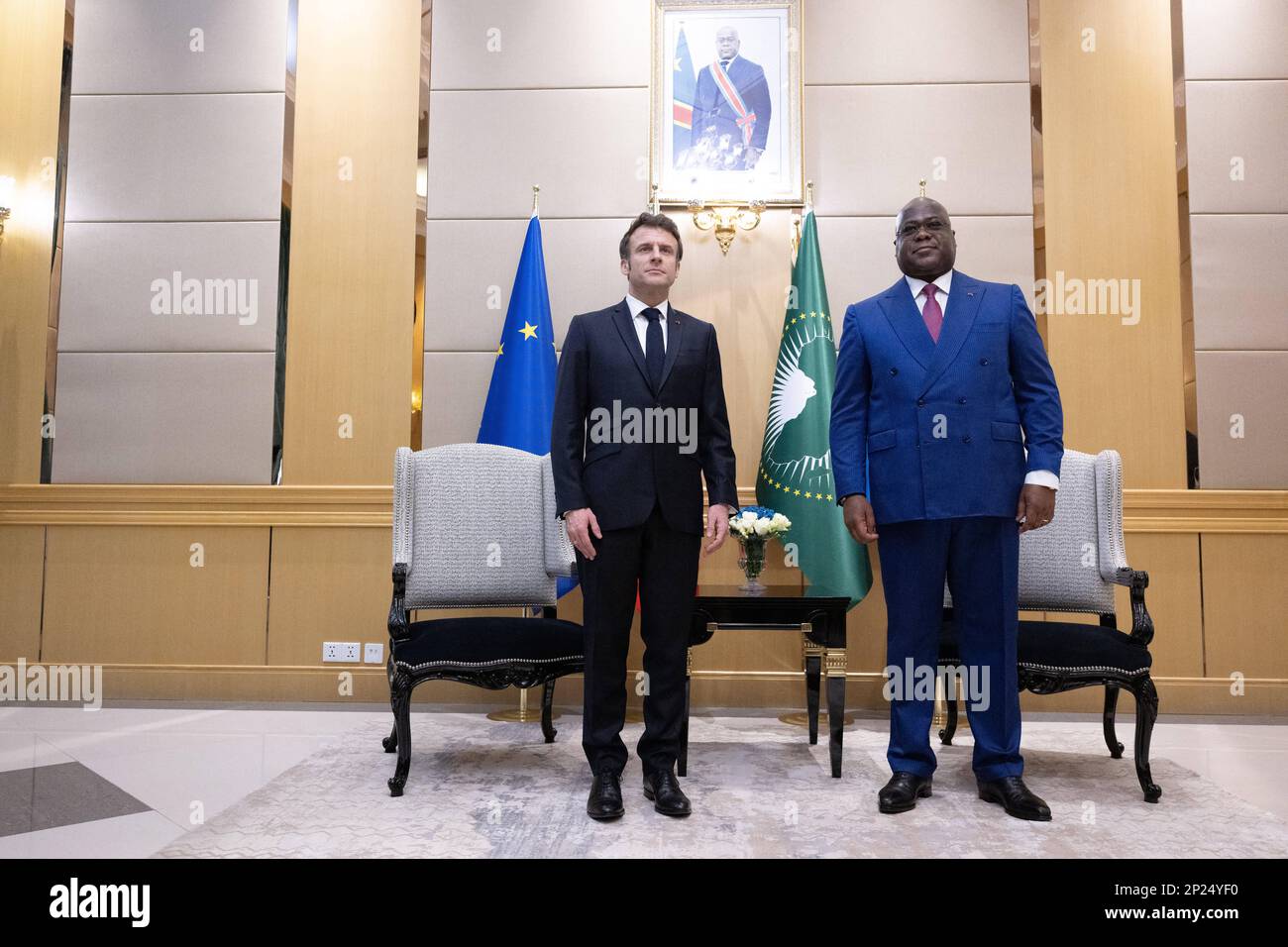 France's President Emmanuel Macron shakes hands with Democratic ...