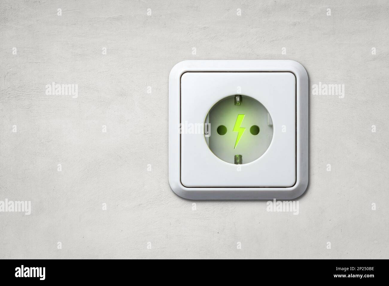 Renewable energy outlet on a wall Stock Photo - Alamy