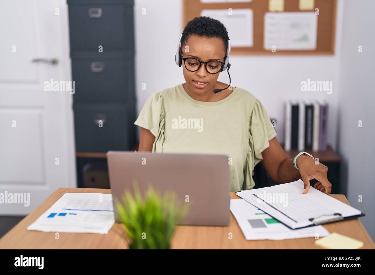 African american woman call center agent working at office Stock Photo ...