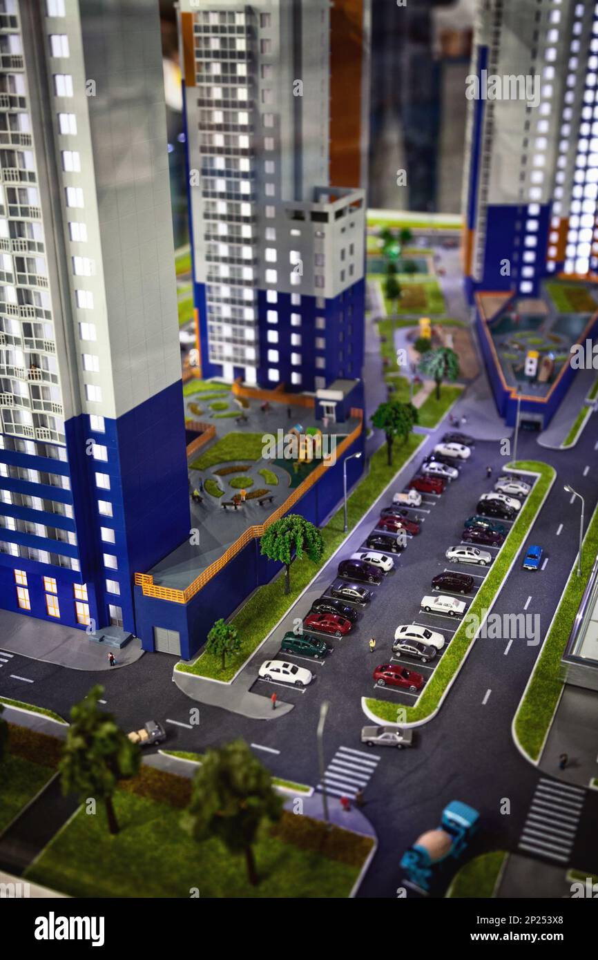 Apartment building project design. Group of miniature house models in ...