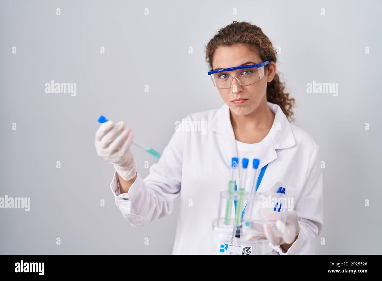 Young caucasian scientist woman working with laboratory samples ...