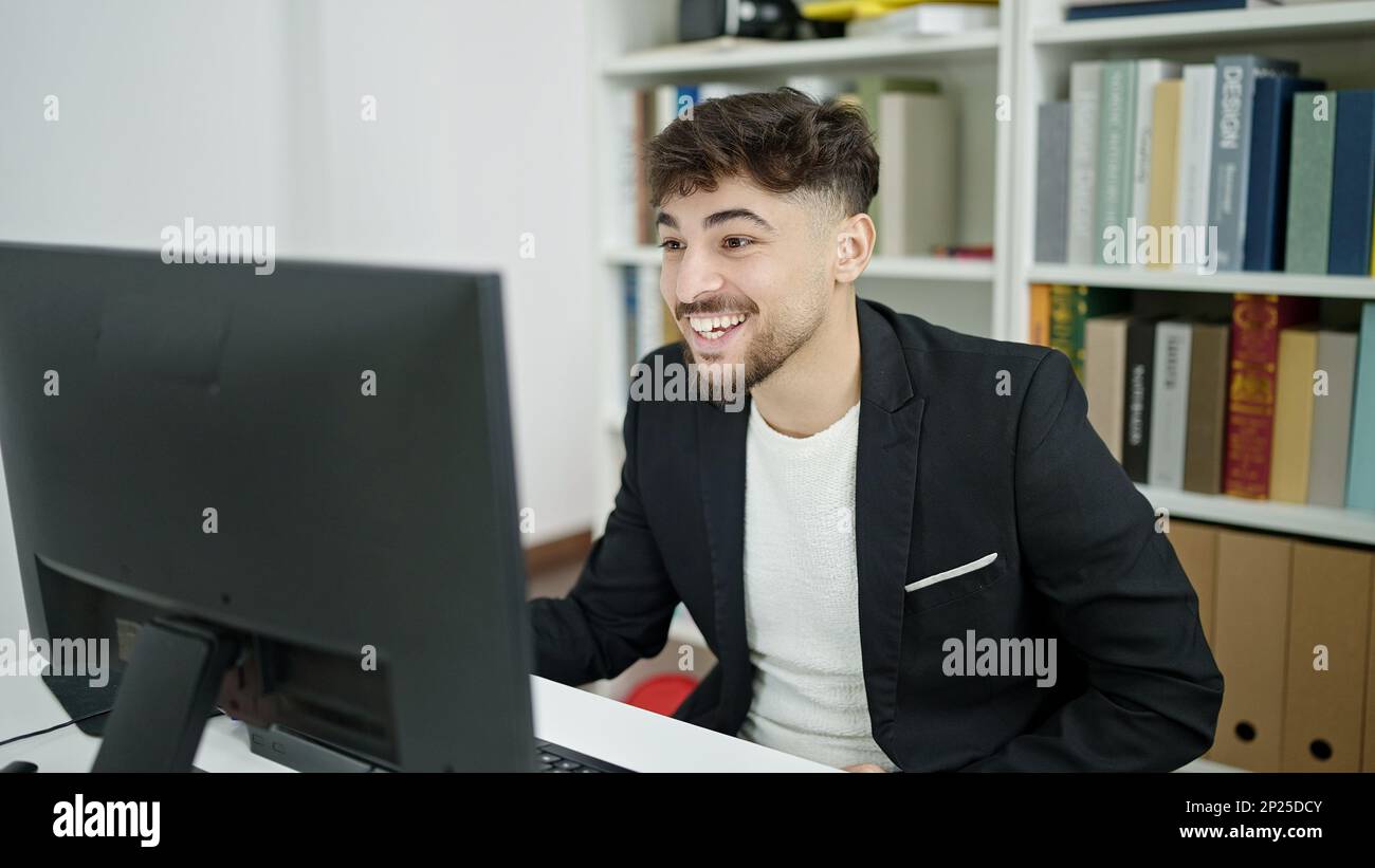 Young arab man student using computer studying at university classroom Stock Photo - Alamy