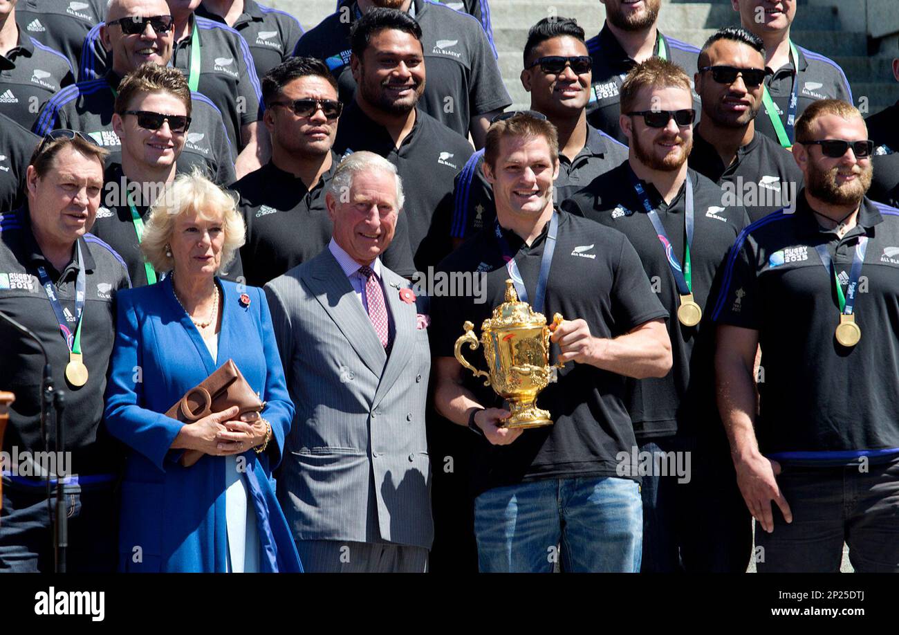 New Zealand rugby captain Richie McCaw holds the Webb Ellis trophy with ...