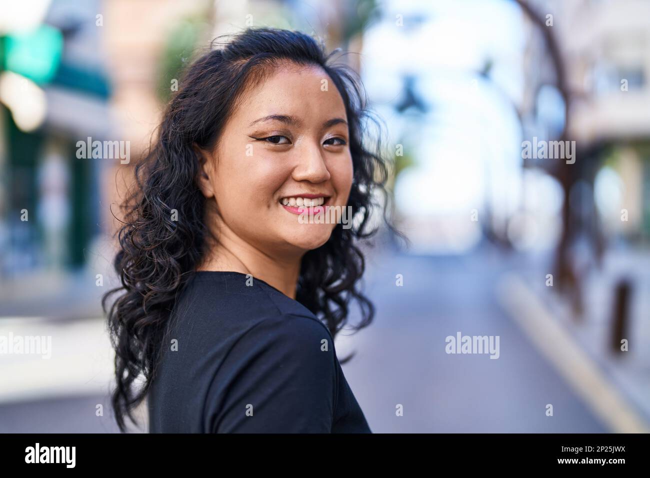 Young chinese woman smiling confident standing at street Stock Photo ...
