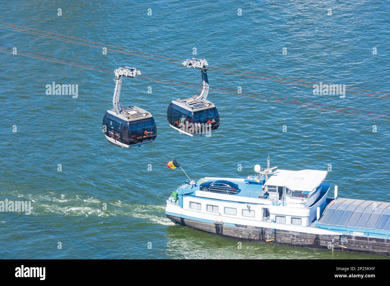 Koblenz: river Rhein (Rhine), cargo ship with container, cable car in ...