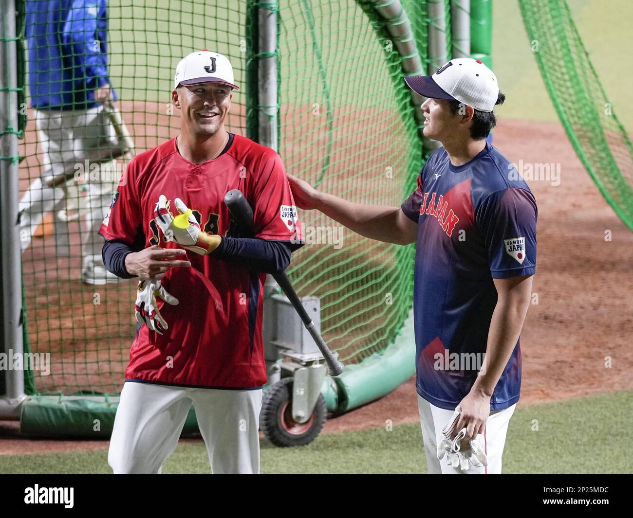 Shohei Ohtani (R) of Japan's national baseball team chats with teammate ...
