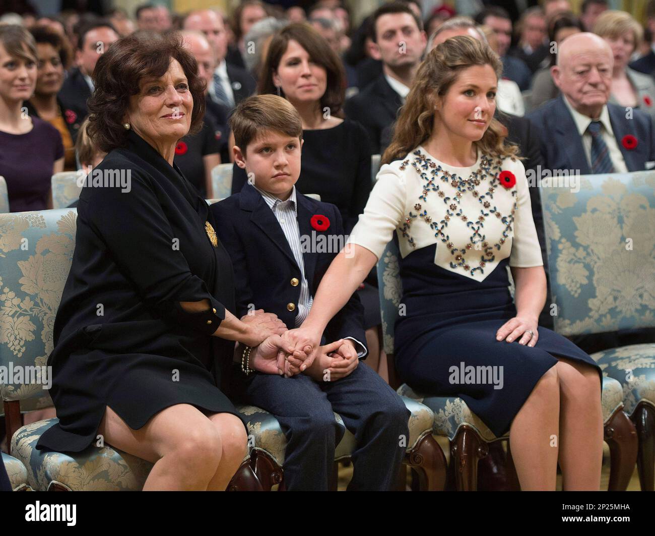 Prime Minister Justin Trudeau's mother Margaret, left, holds hands with ...