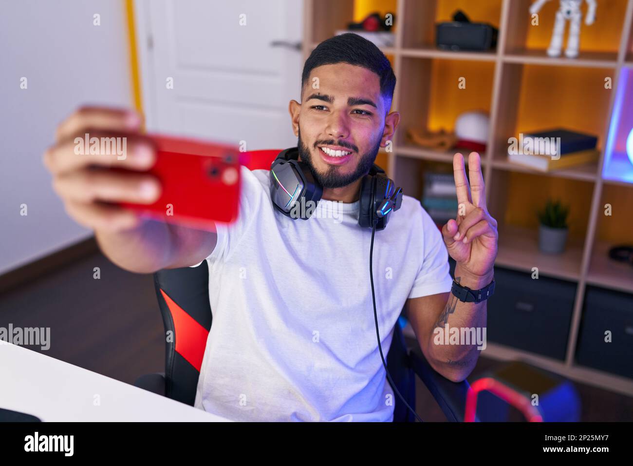 Young latin man streamer smiling confident make selfie by smartphone at ...