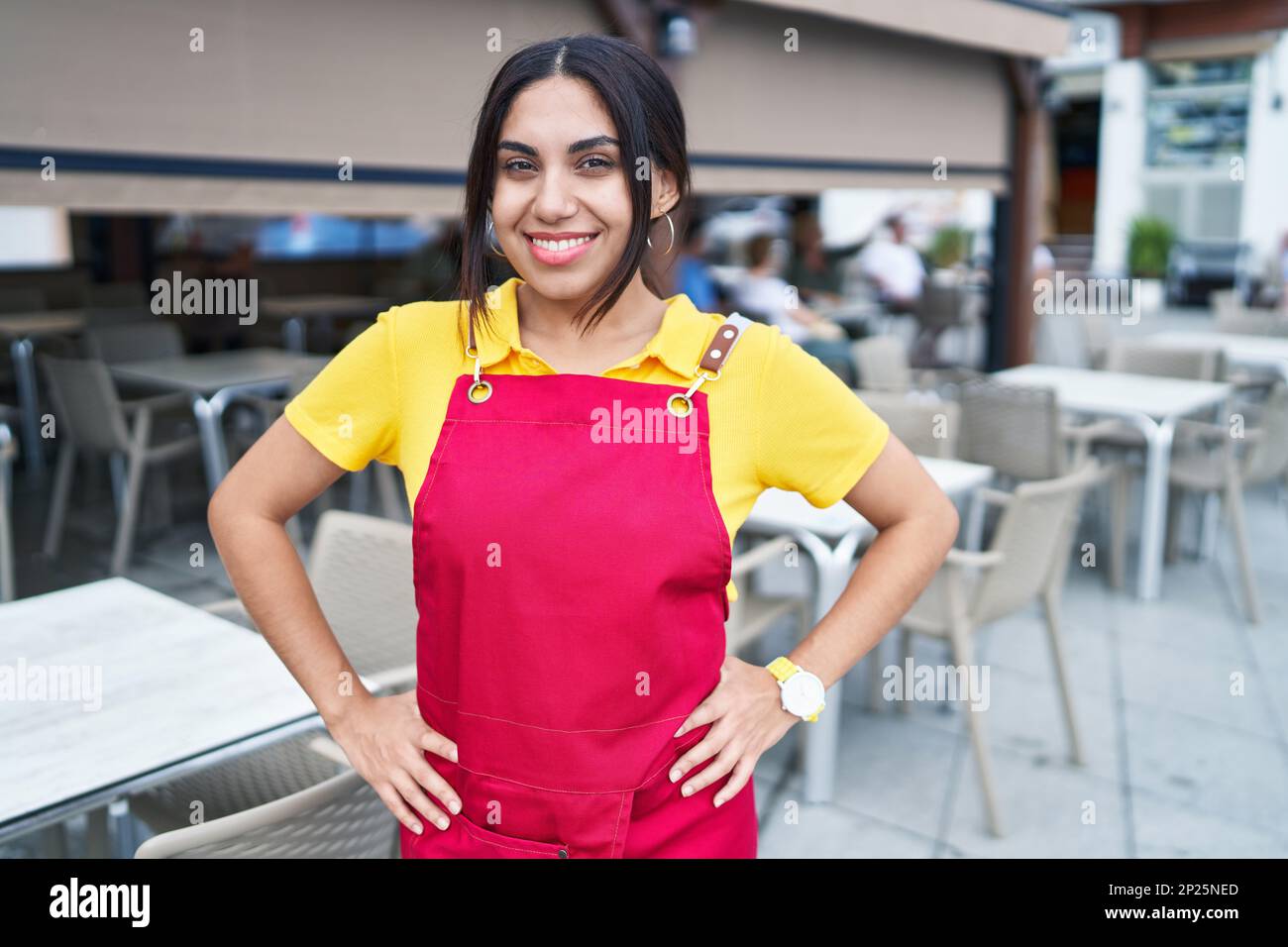 Young beautiful arab woman waitress smiling confident standing at ...