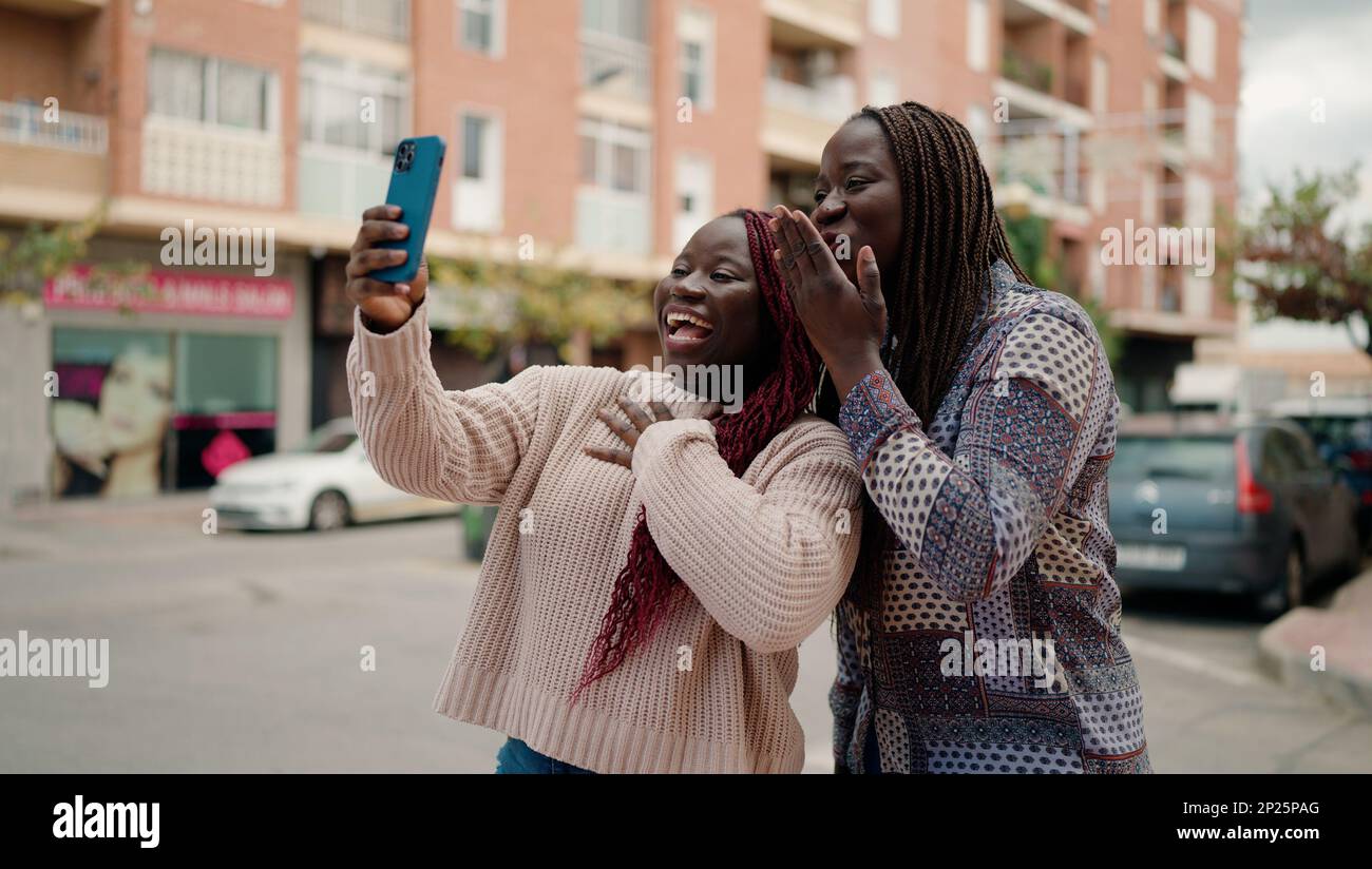 Two african american friends smiling confident having video call at ...