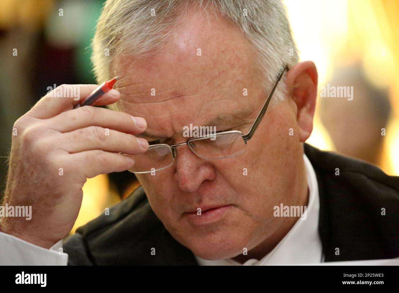 Defence lawyer Barry Roux waits before the hearing gets under way in ...