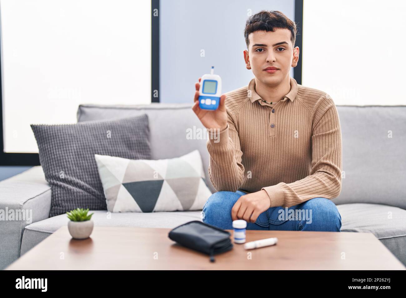 Non binary person using blood pressure monitor thinking attitude and ...