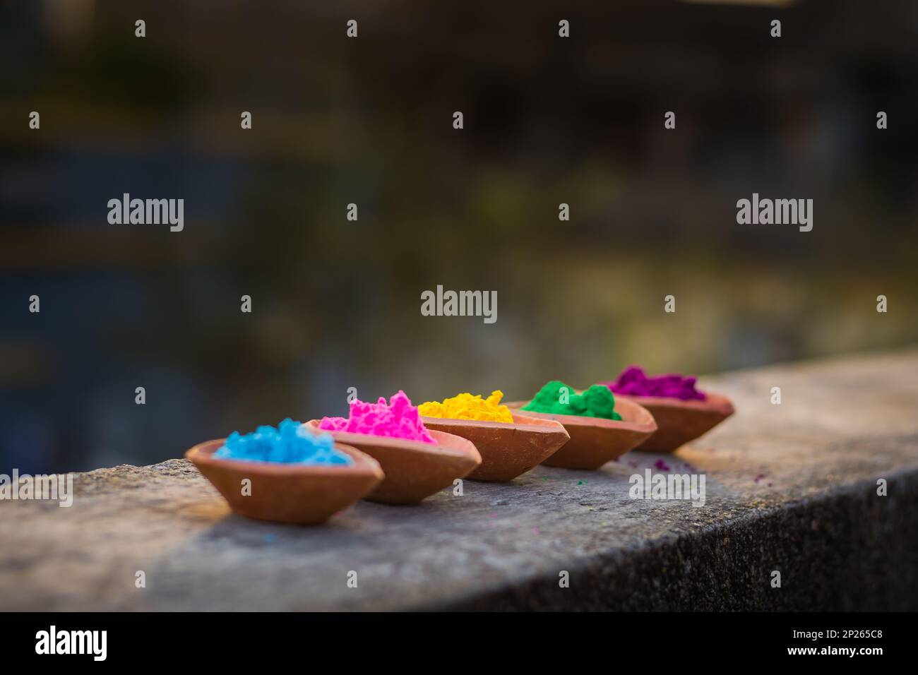 happy holi. gullal or abir, which are colorful powders for holi kept on ...