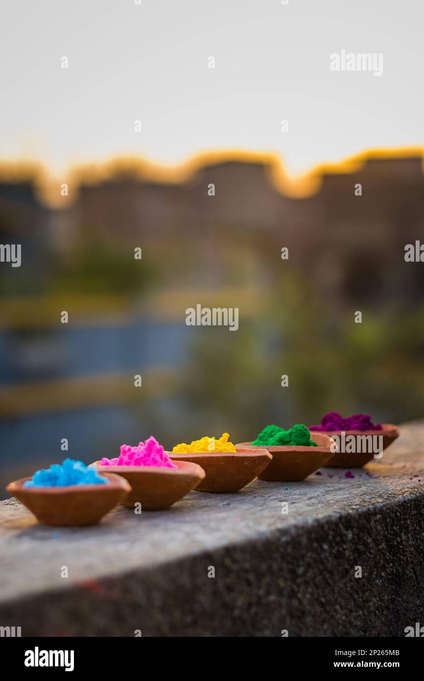 happy holi. gullal or abir, which are colorful powders for holi kept on ...