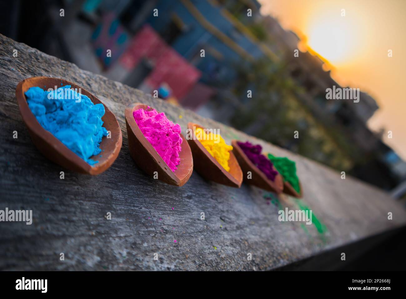 happy holi. gullal or abir, which are colorful powders for holi kept on ...
