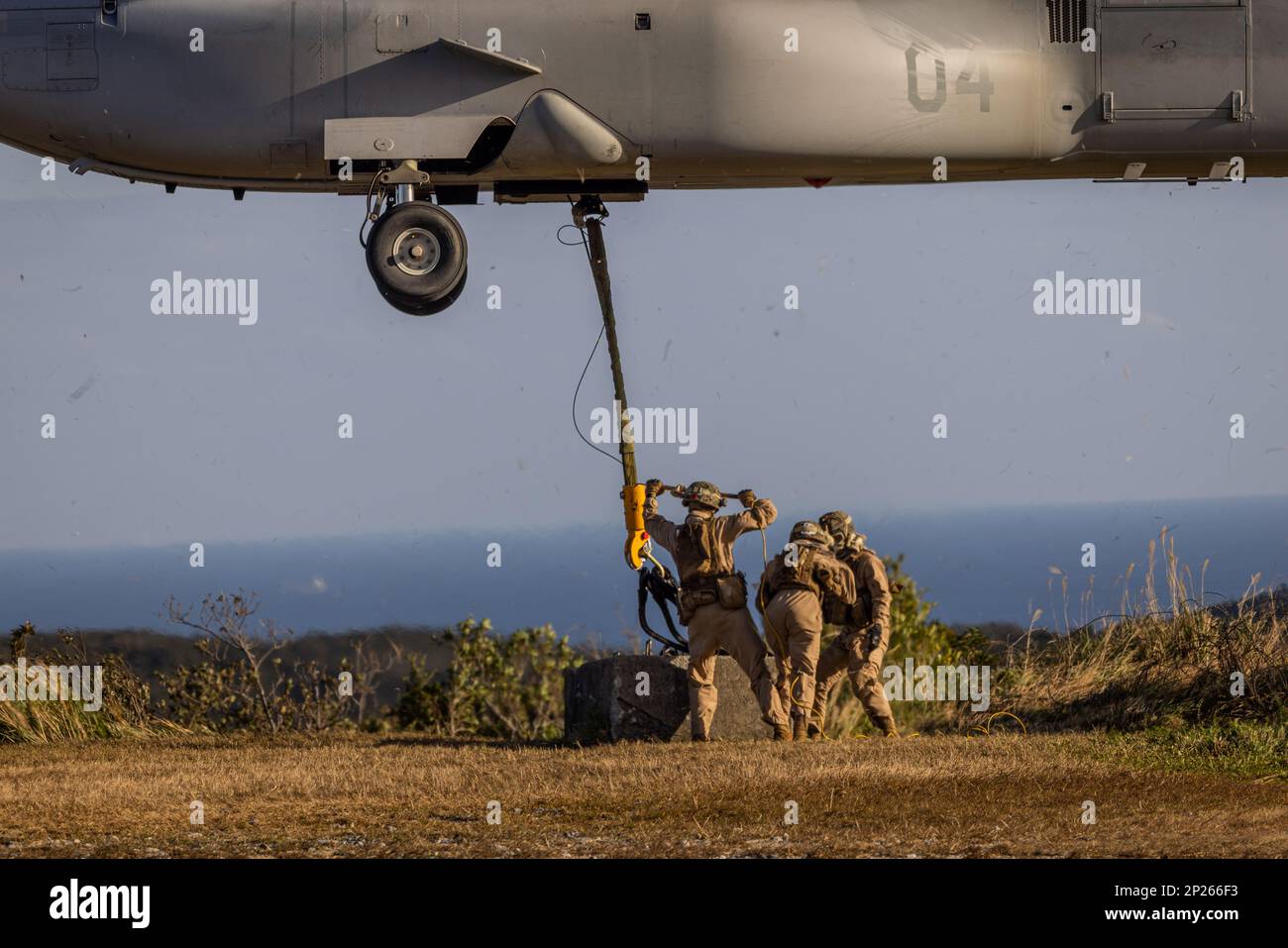 U.S. Marines with 3rd landing support battalion (LSB) attach a concrete ...