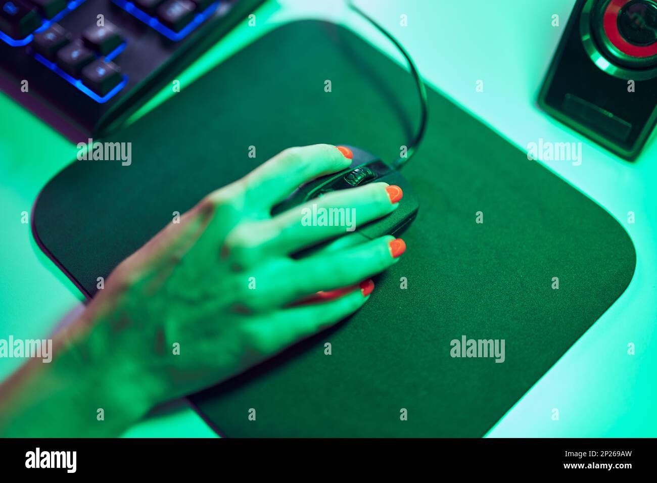 Young blonde woman streamer using mouse computer at gaming room Stock ...